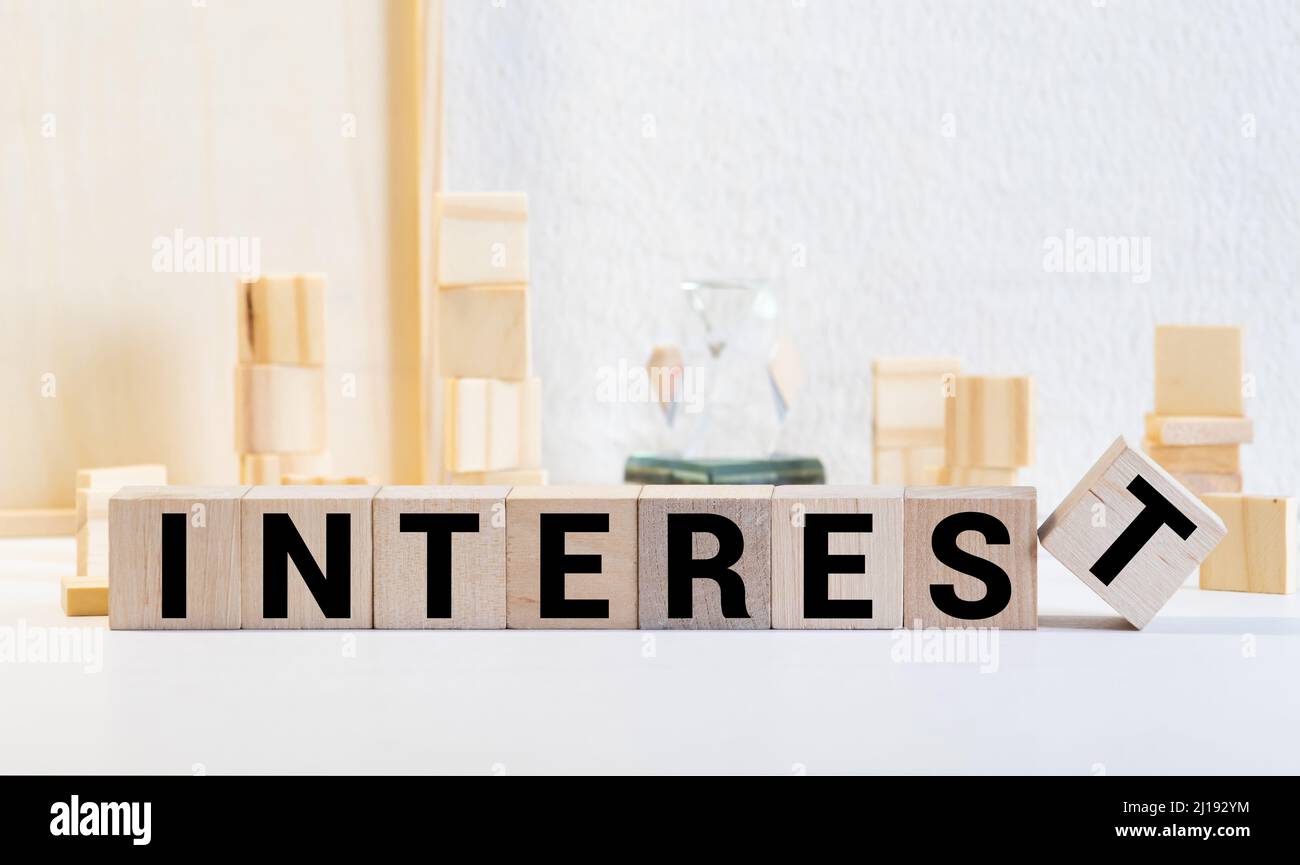 INTEREST word made with building blocks, concept Stock Photo - Alamy