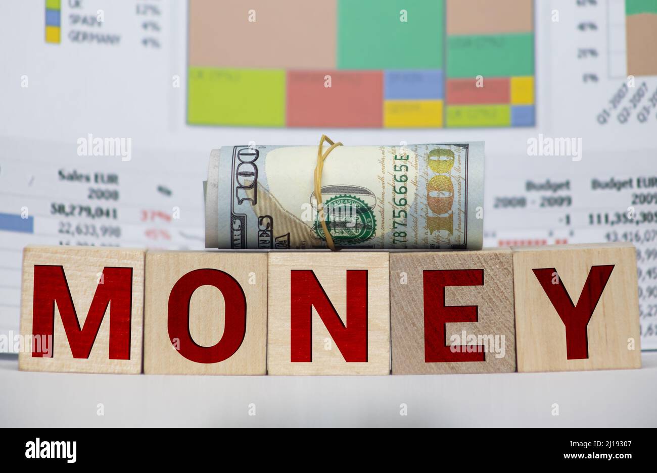 Wooden blocks with the word Money and a pile of coins, Money climbing ...