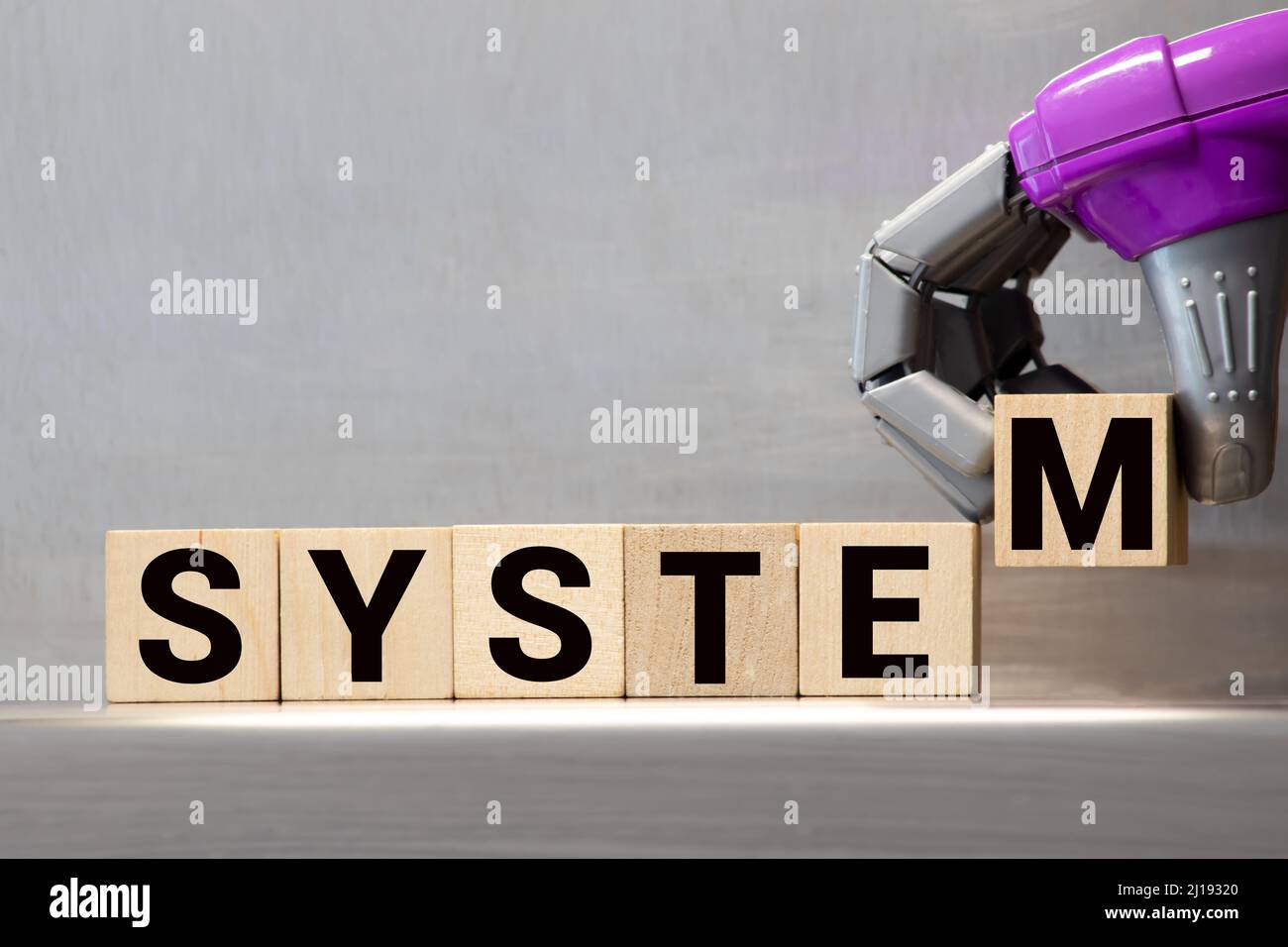 word system from small gray wooden letters lies on a blue background ...