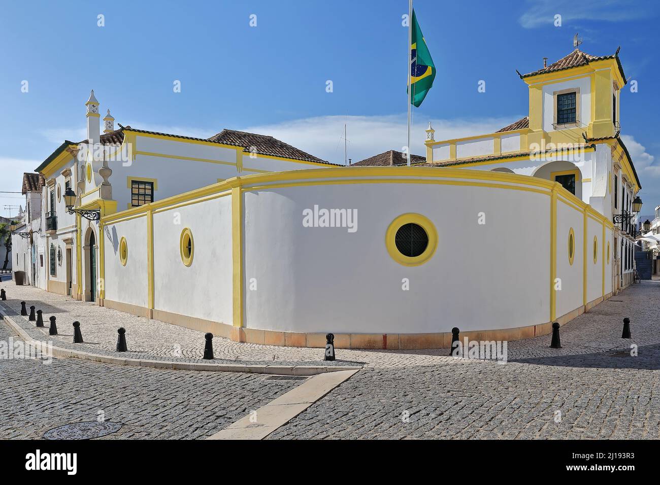 Whitewashed wall-yellow edge line-Brazilian consulate wall and flag ...