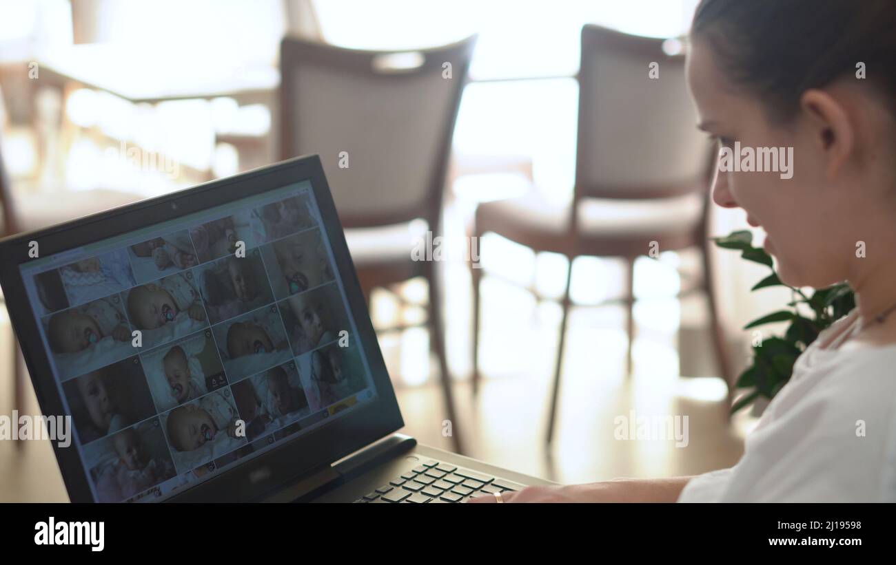 Side view Authentic Young Woman Chatting On Laptop At Home In Living ...