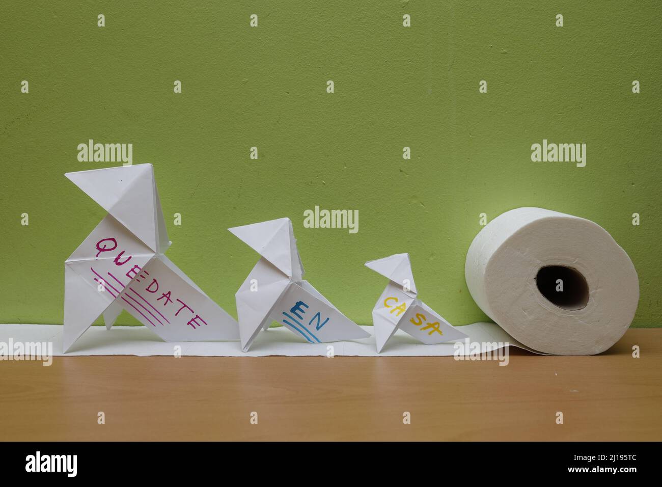 Some paper-made dog-shaped origami placed on toilet paper Stock Photo ...