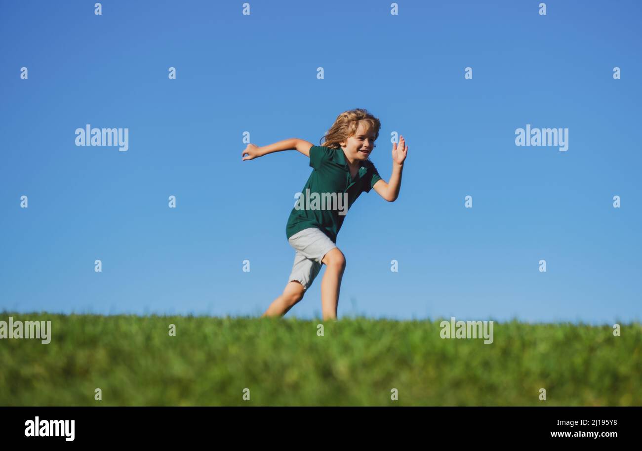 Happy kids playing and running on grass outdoors in summer park. Active ...