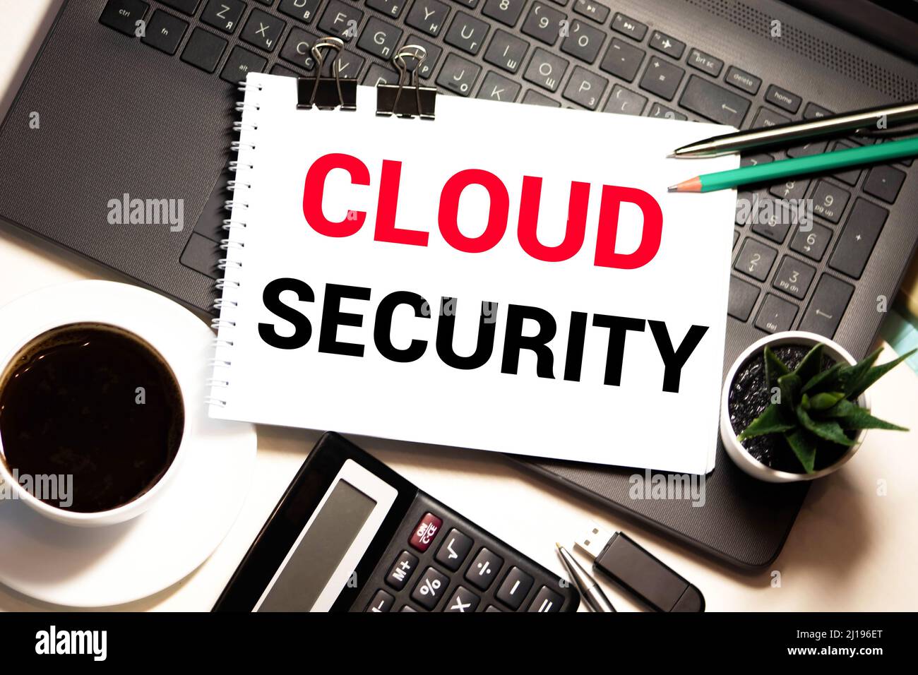 young man pointing at CLOUD SECURITY text on virtual screen. soft light with vintage filter ...