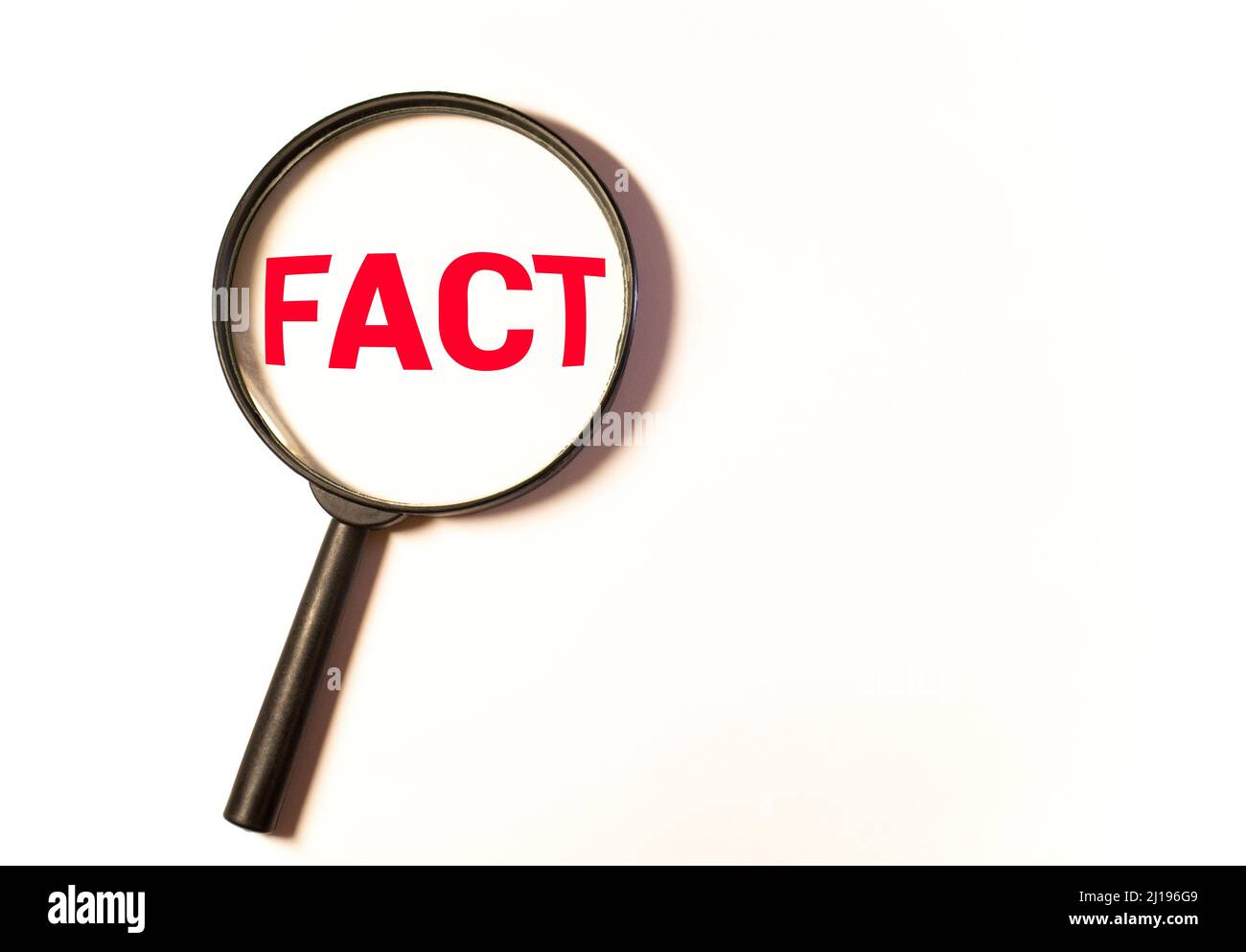 Hand Showing Facts Word Through Magnifying Glass Stock Photo - Alamy