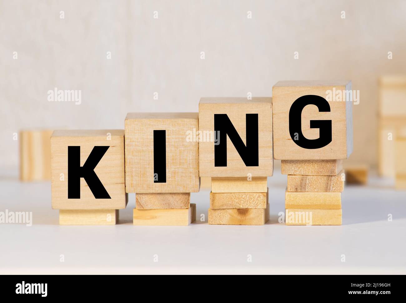 King word written on wood cube with red background Stock Photo - Alamy