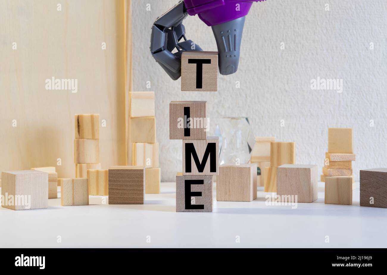the concept of time. hand men in business suit holding the cubes which ...
