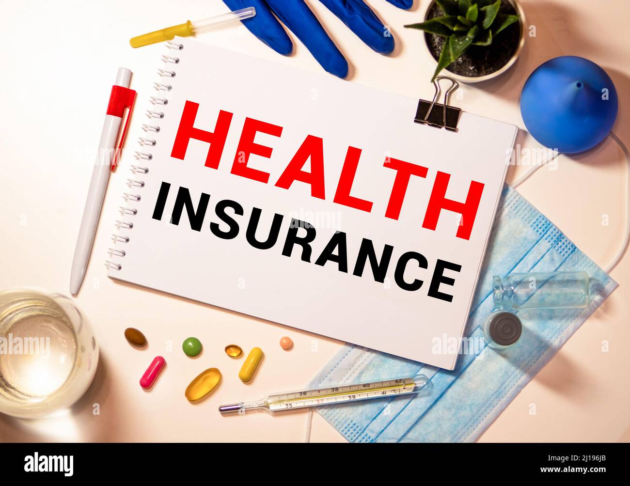 health insurance word written in a notebook, medical concept Stock ...