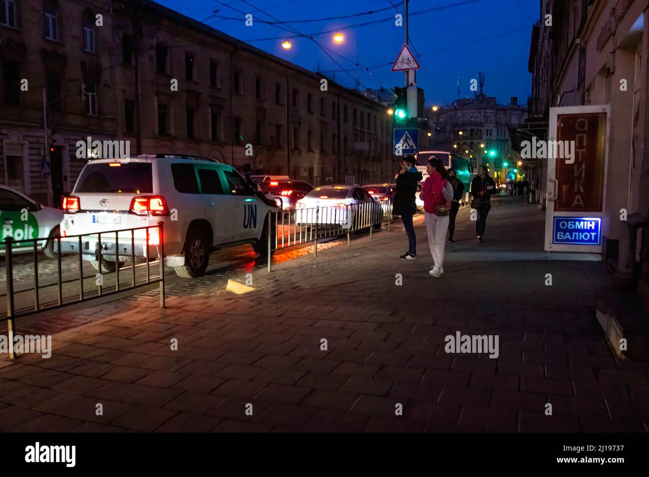 A UN SUV drives in traffic at night. (Photo by Ty O'Neil / SOPA Images ...