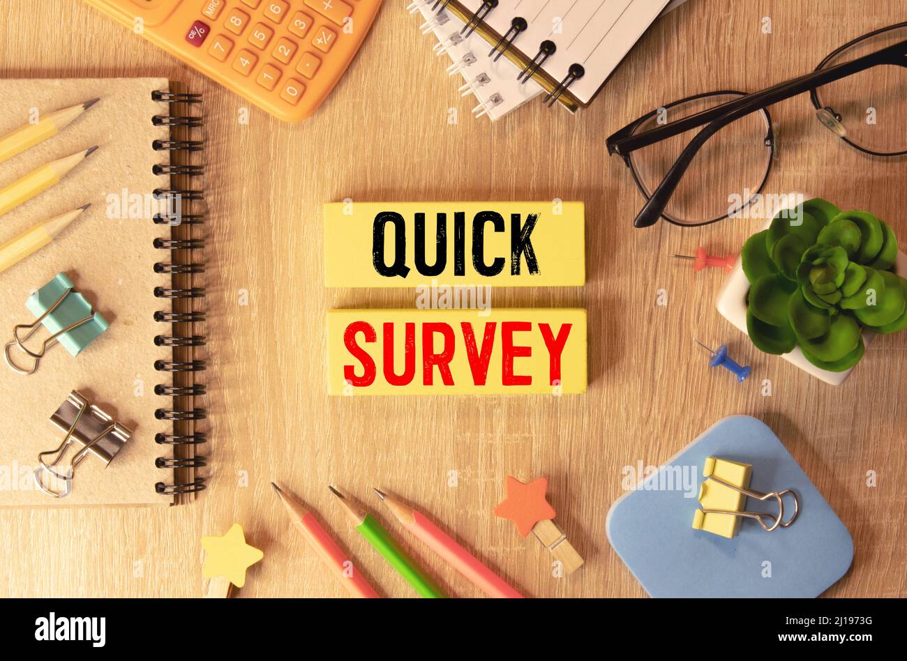 Quick Survey text written on a notebook with pencils Stock Photo - Alamy