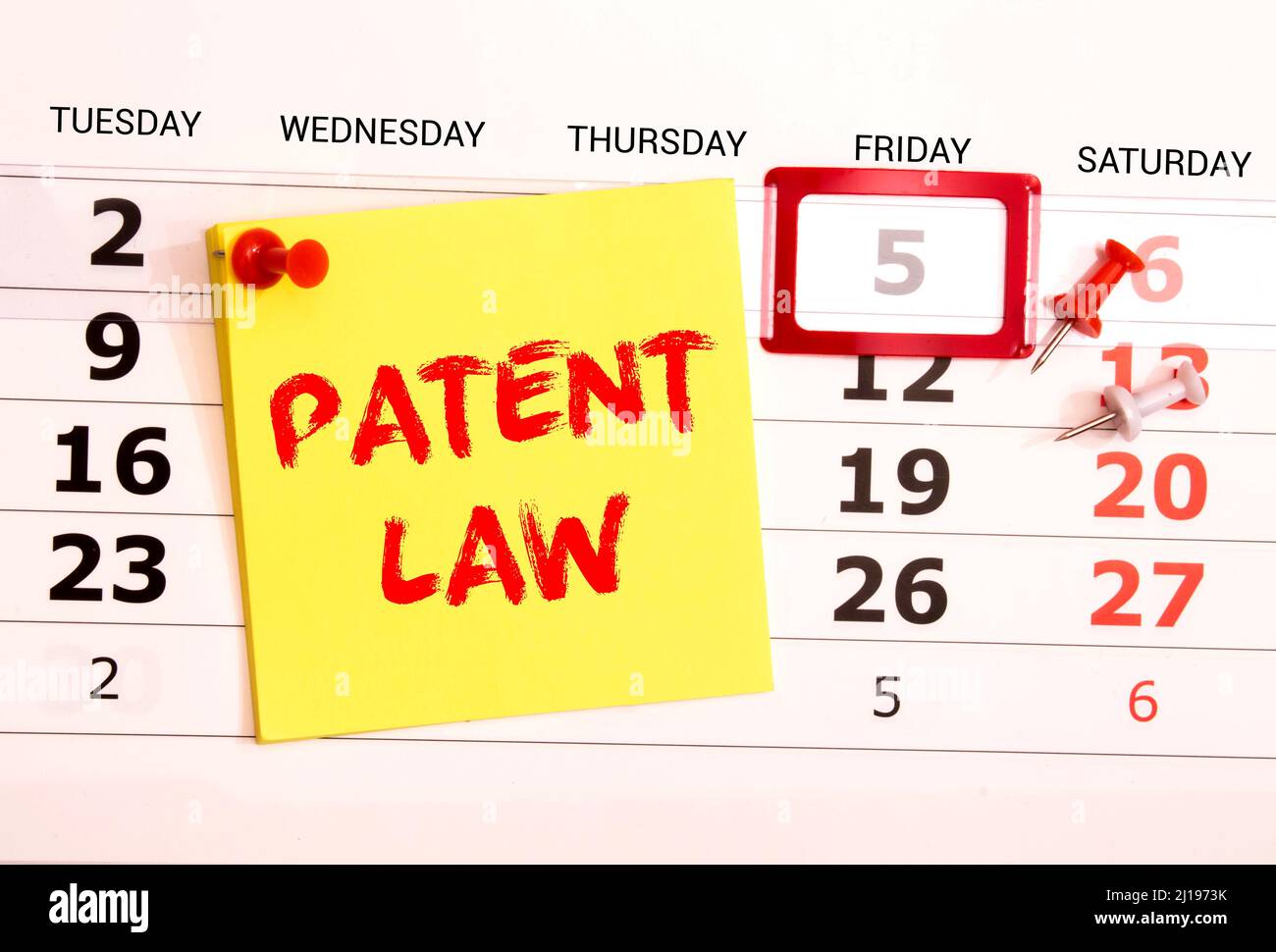Business and law concept. Between two sheets of notebook on a red ...