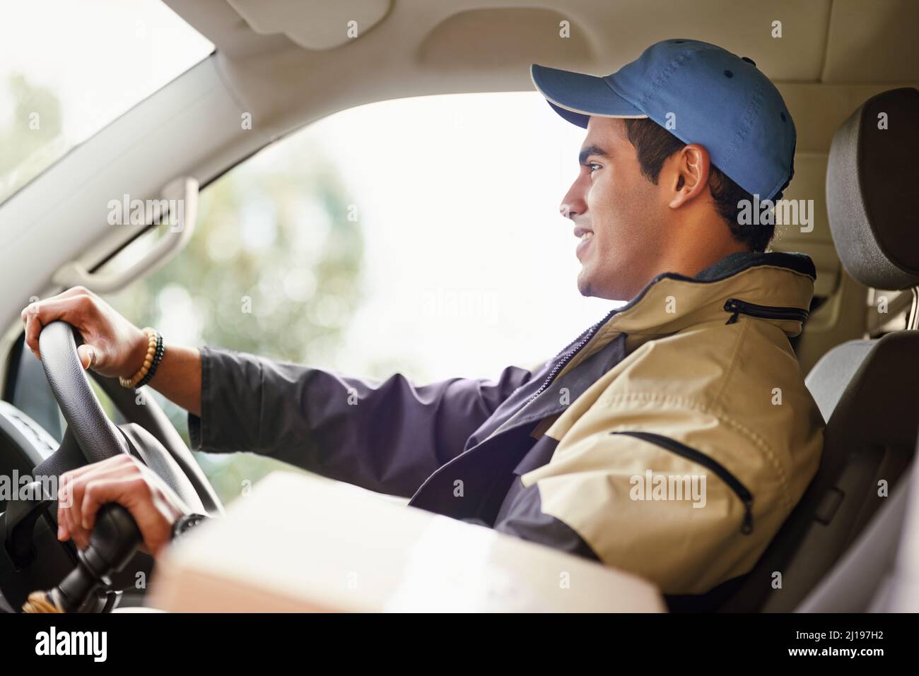 Aiming to get his deliveries done on time. Cropped shot of a delivery ...