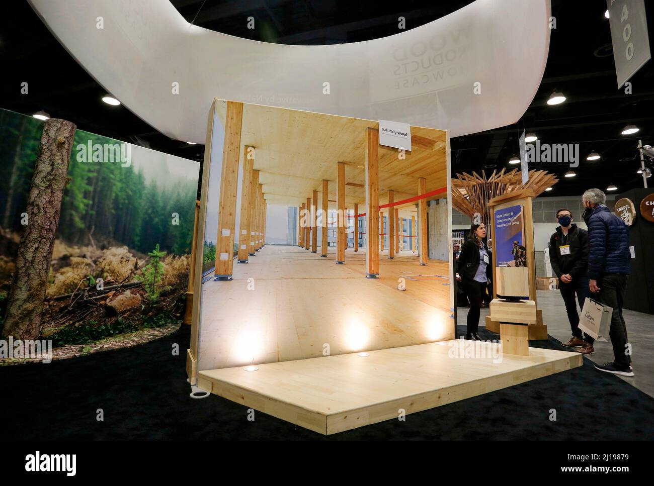 Vancouver, Canada. 23rd Mar, 2022. A visitor talks with exhibitors ...