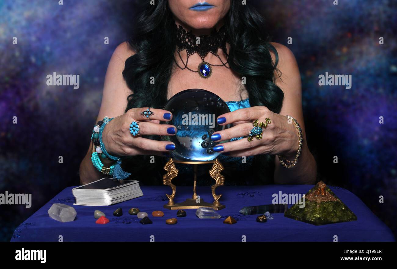 Female Psychic with crystal ball and tarot cards, Shallow DOF Stock ...