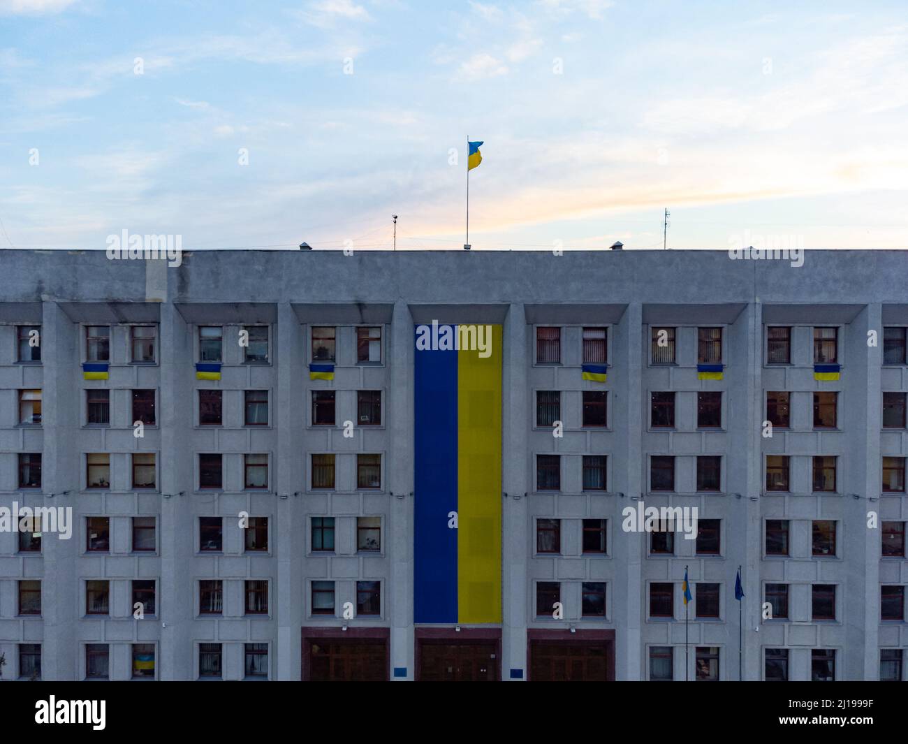 Aerial photo of Ukrainian flag on administration building in Poltava ...