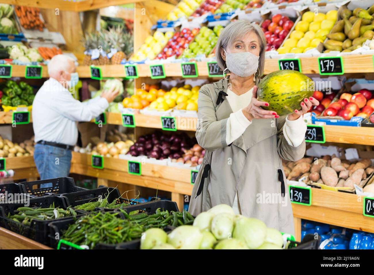 Woman in mask choosing green hi-res stock photography and images - Alamy