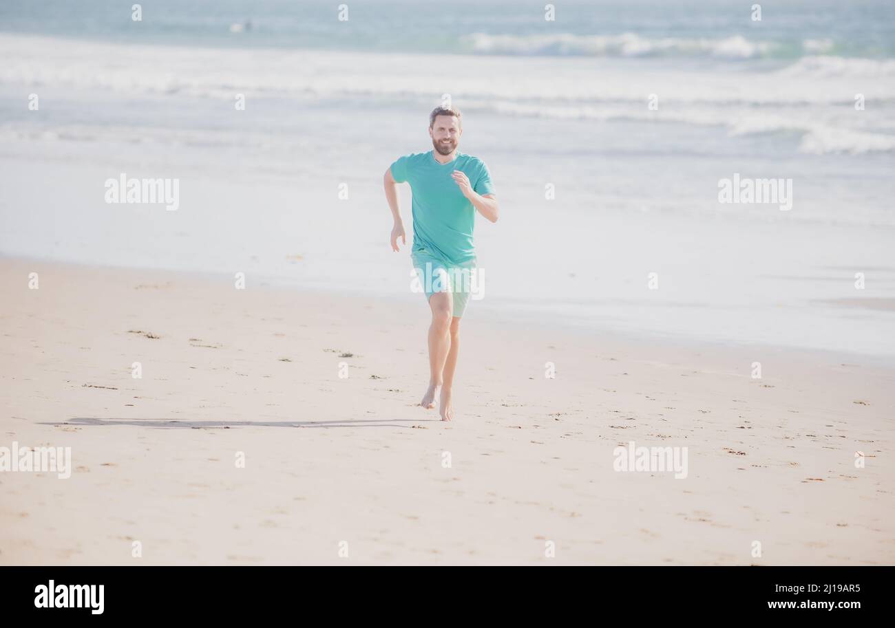 Male runner sandy beach hi-res stock photography and images - Alamy