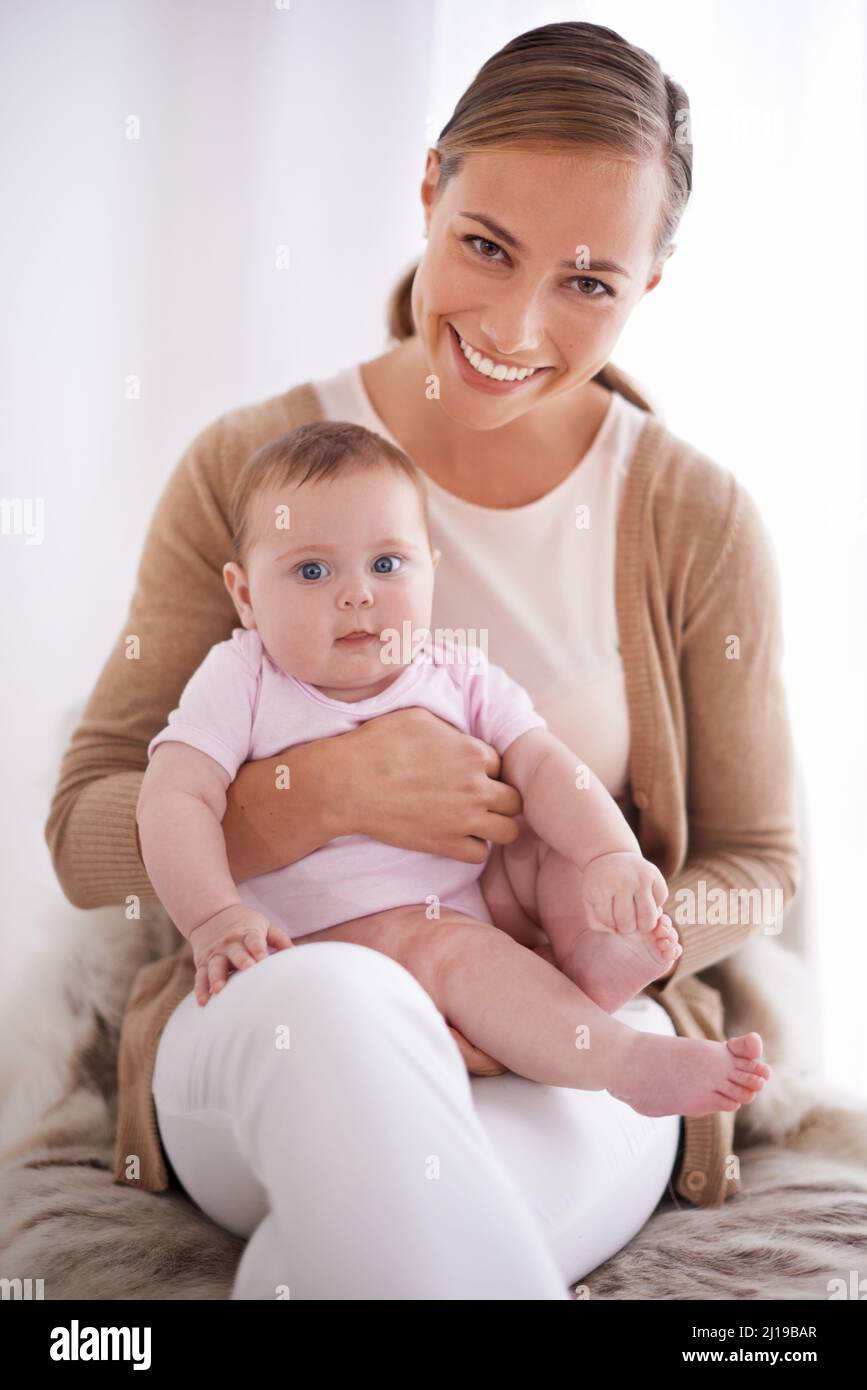 Shes such a proud mom. Shot of a young mother bonding with her baby ...