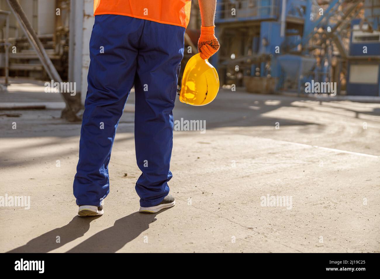 Frustrated foreman with hard hat in factory Stock Photo - Alamy