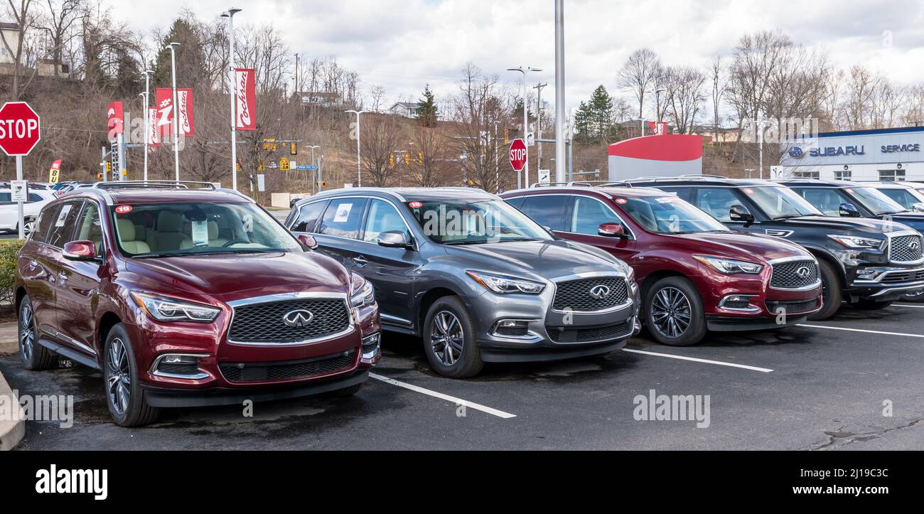 Different Infinity vehicles for sale lined up at a dealership in ...