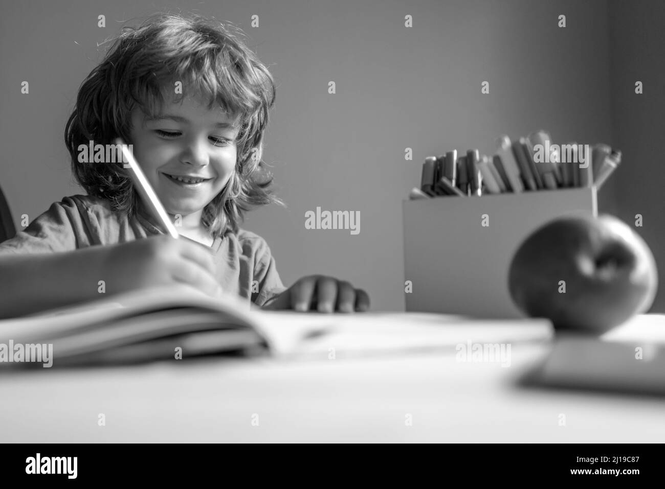 Little kid boy is doing his homework for elementary school Stock Photo ...