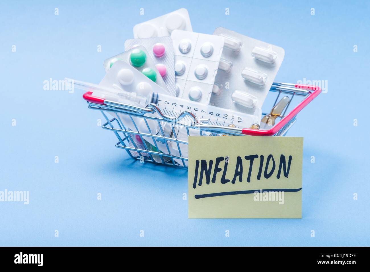 A basket with medical preparations in it on a blue background with ...