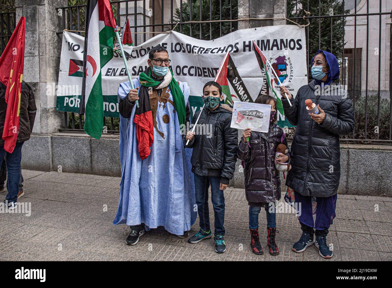 Burgos, Spain. 23rd Mar, 2022. A Saharawi family hold flags of Western ...