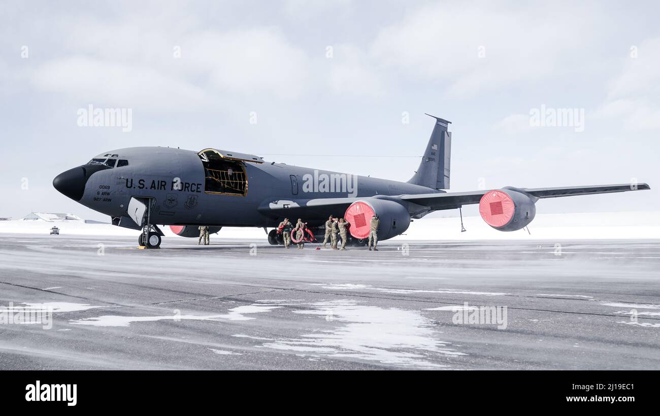 Maintainers assigned to the 6th Maintenance Group place engine covers ...
