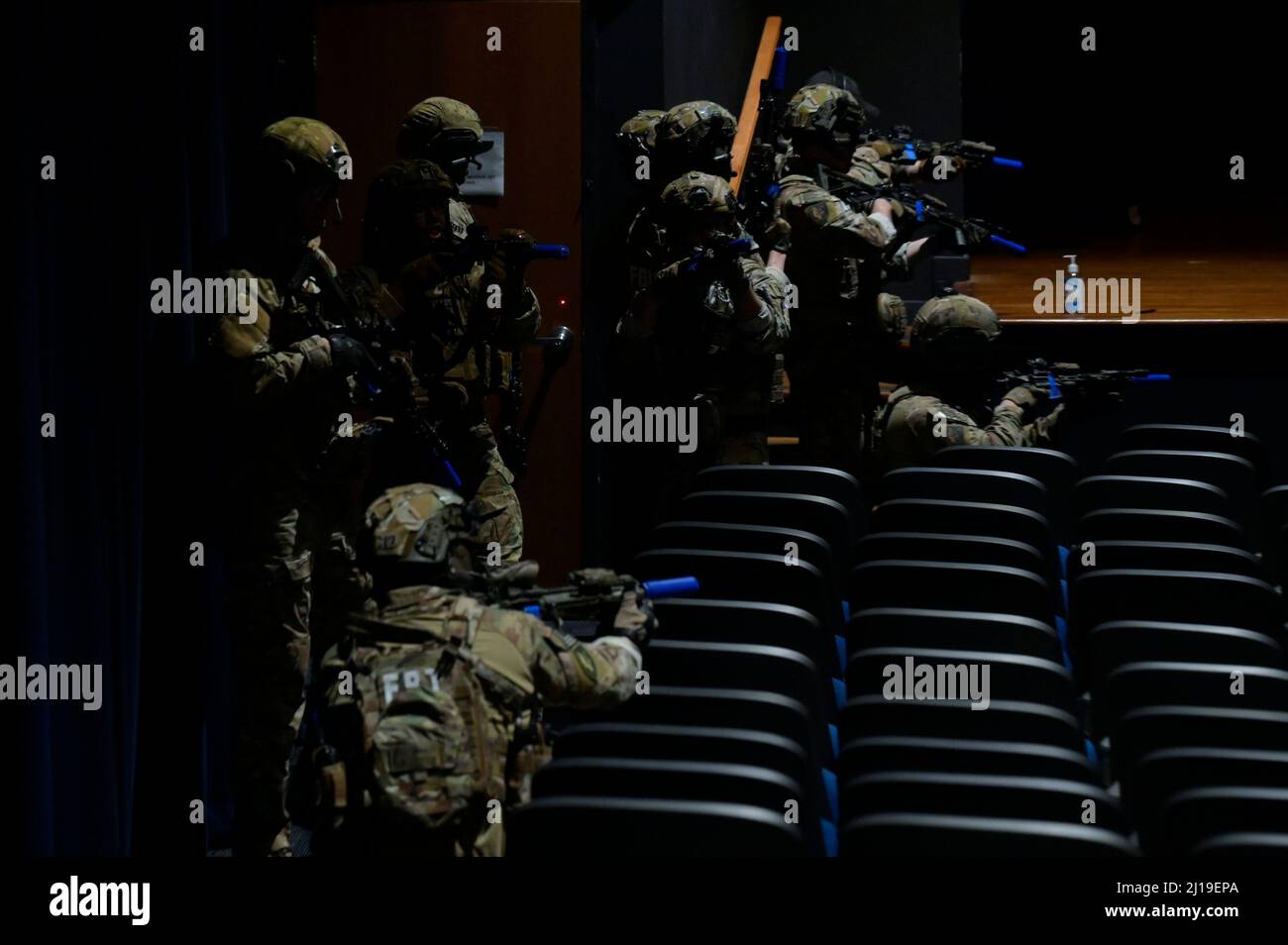Members of the Federal Bureau of Investigation SWAT team clear a ...