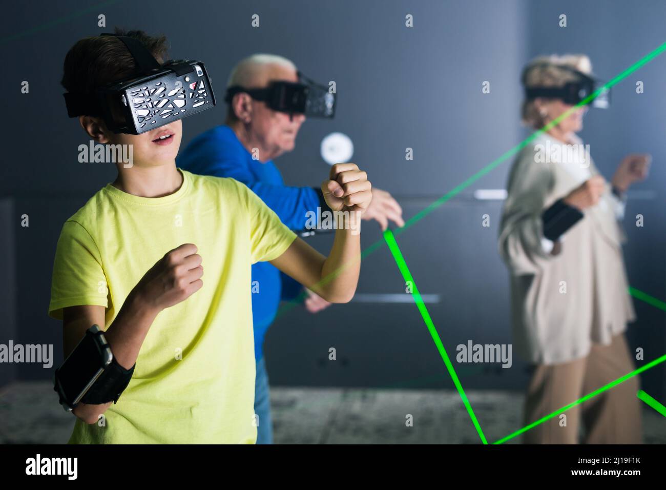 Boy playing VR games with his family Stock Photo - Alamy