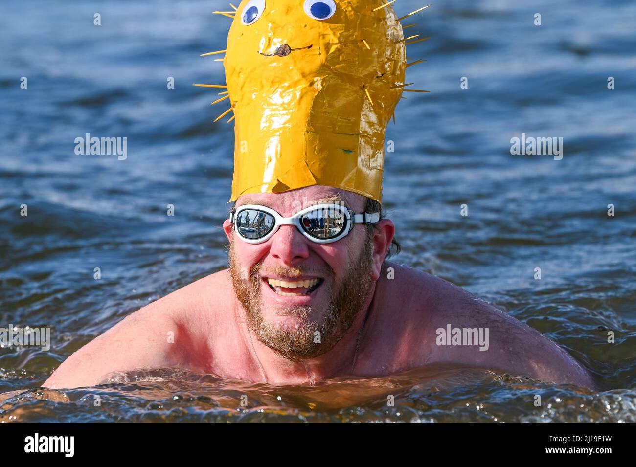 Cold water swimmers swim in the icy water of Lake Memphremagog near the ...