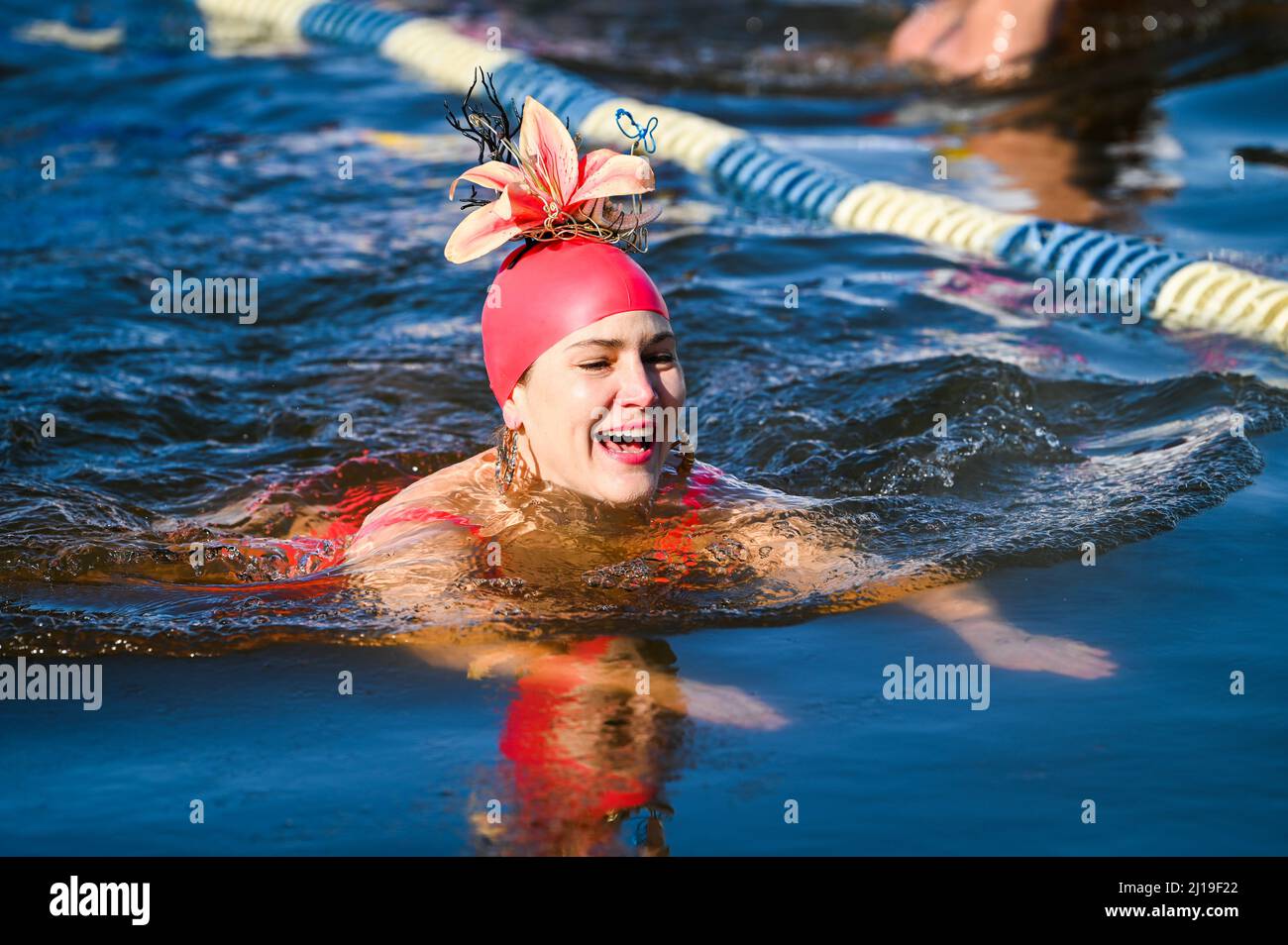 Cold water swimmers swim in the icy water of Lake Memphremagog near the ...