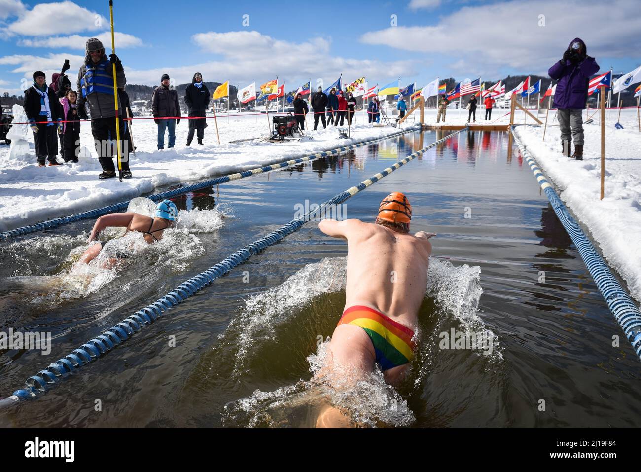 Cold water swimmers swim in the icy water of Lake Memphremagog near the ...