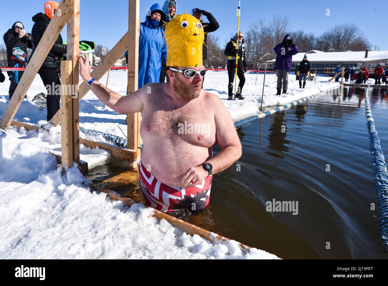 Cold water swimmers swim in the icy water of Lake Memphremagog near the ...