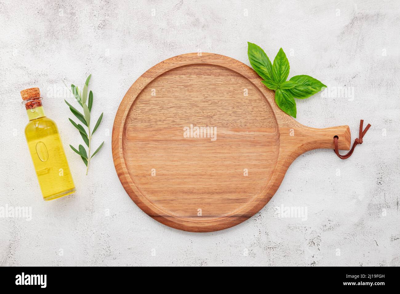 Empty wooden pizza platter set up on white concrete. Pizza tray on ...