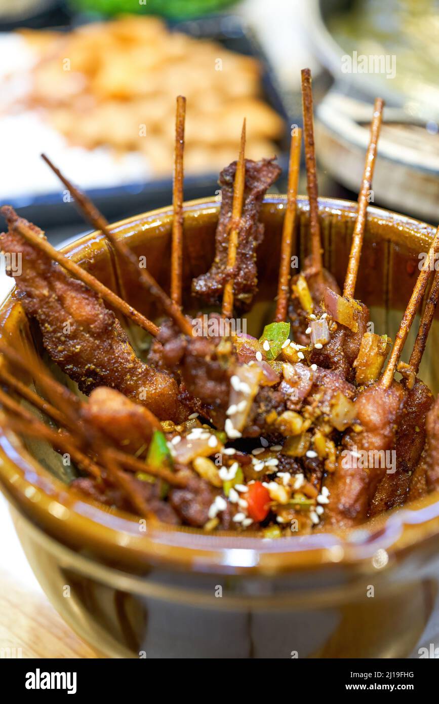 A crispy and delicious Chinese dish, fried rabbit skewers Stock Photo ...