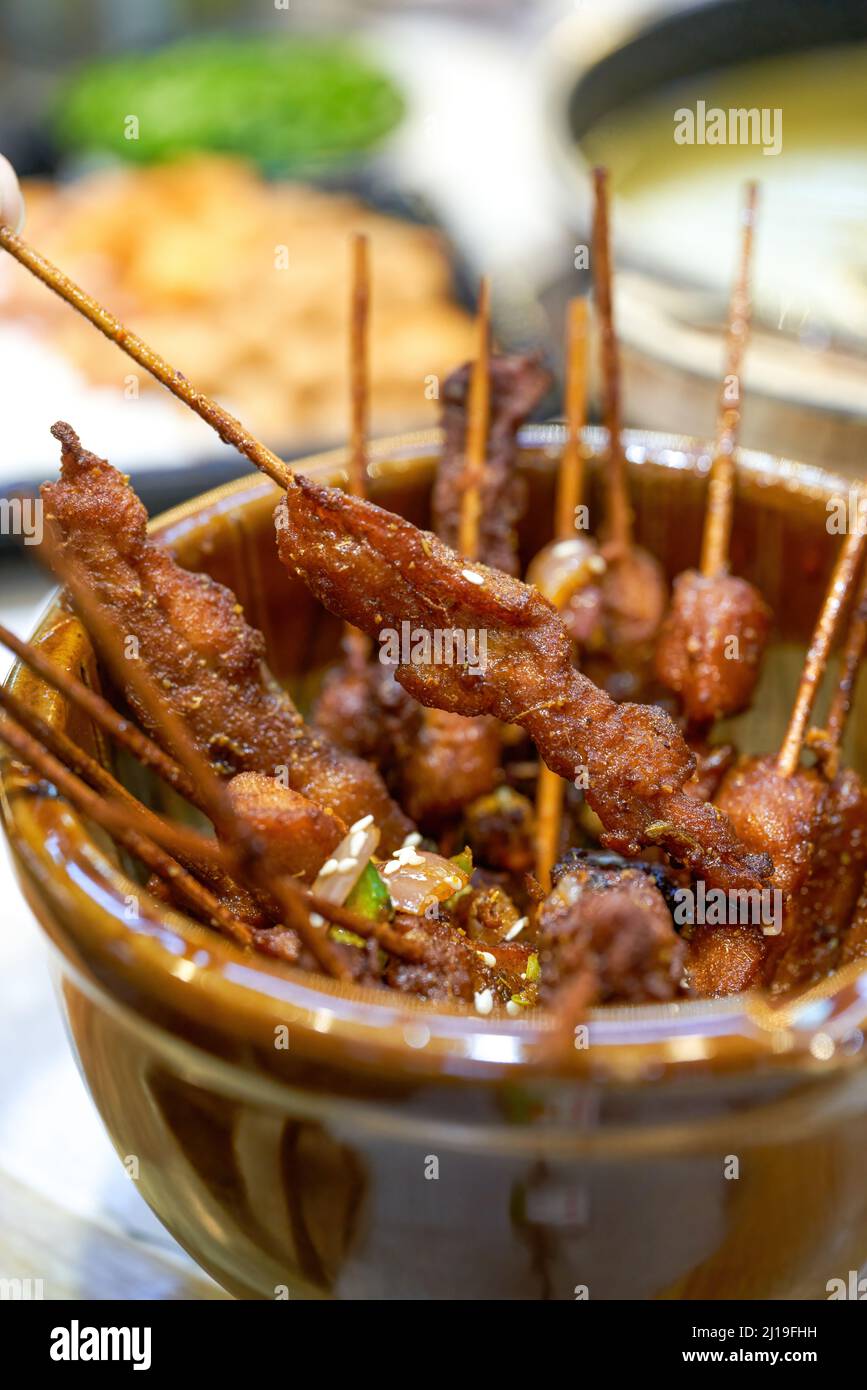 A crispy and delicious Chinese dish, fried rabbit skewers Stock Photo ...