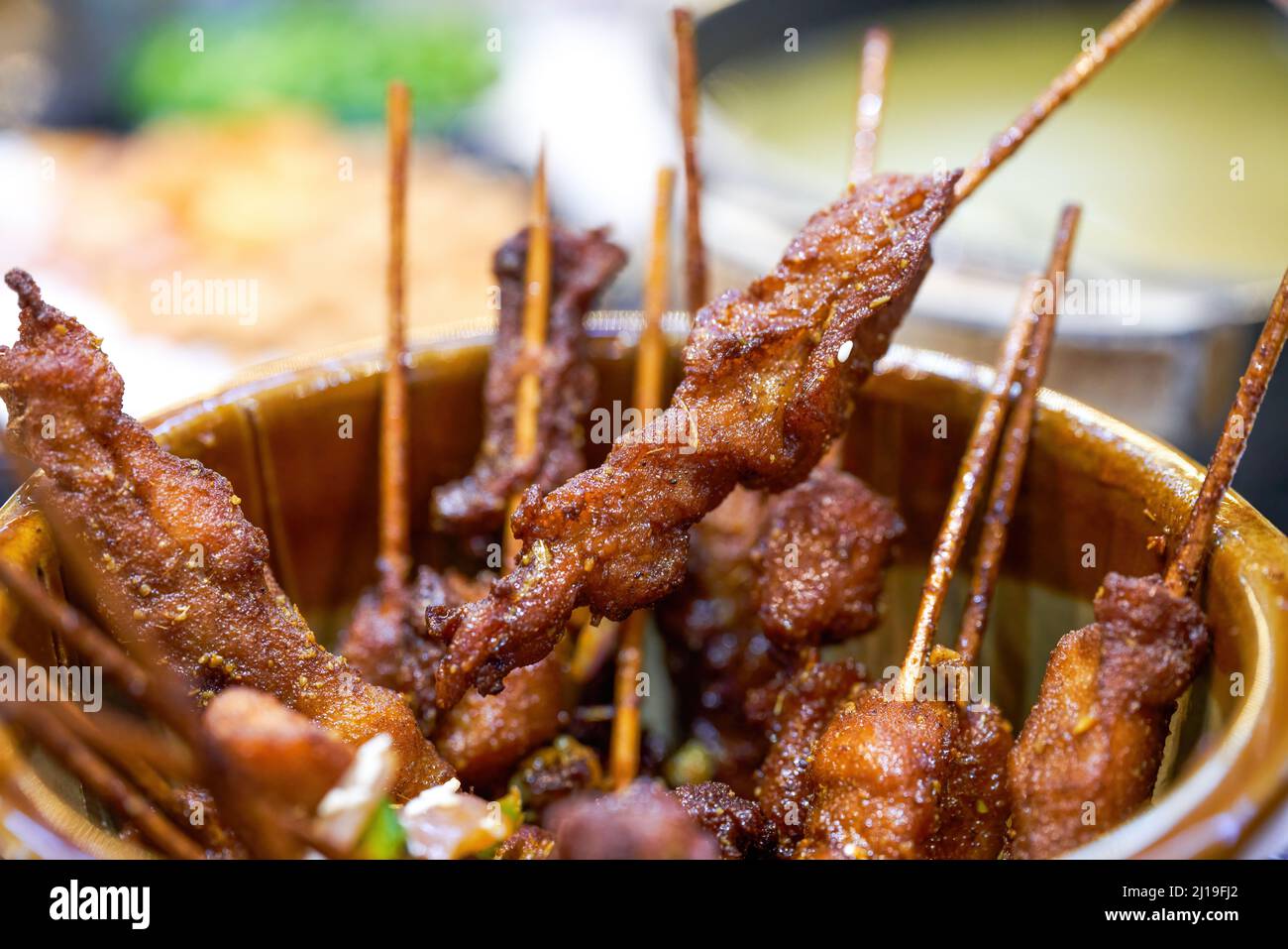 A crispy and delicious Chinese dish, fried rabbit skewers Stock Photo ...
