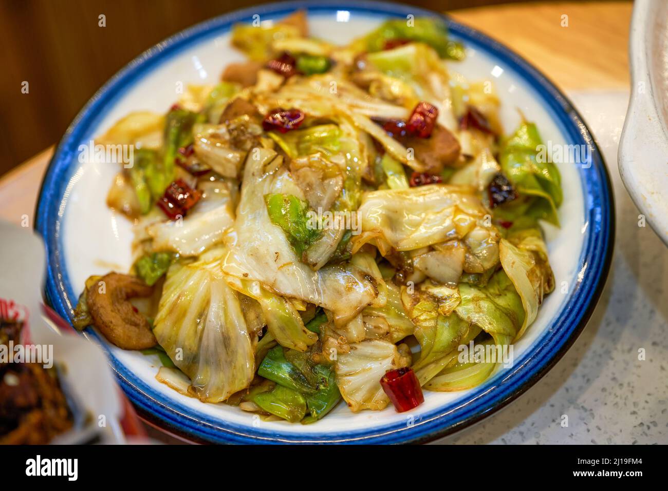 A delicious and spicy Chinese home-style dish, shredded cabbage Stock ...