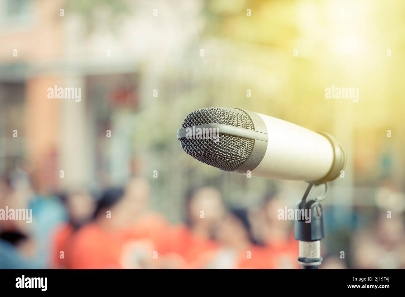 Close up of microphone in public place with blur background Stock Photo ...