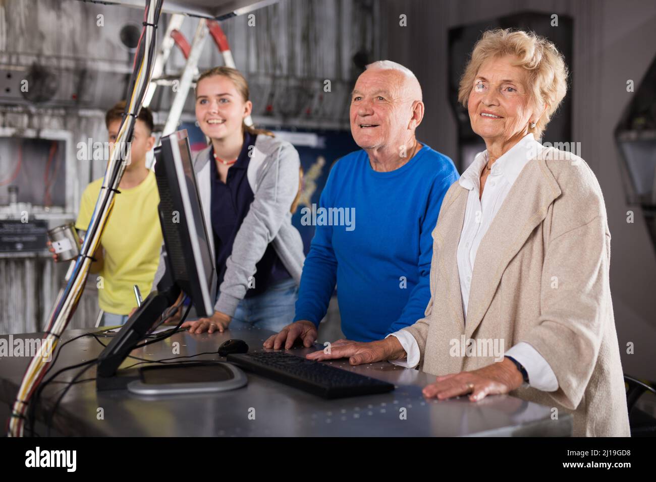 Family is using PC in time having fun together in lost labroom Stock ...