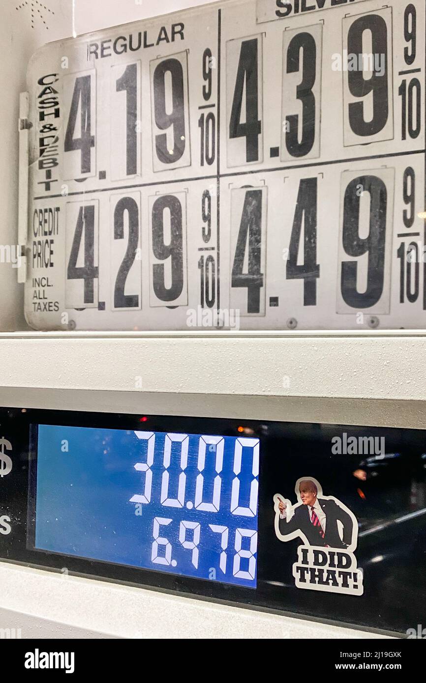 A sticker of President Joe Biden pointing to high gas prices with the ...