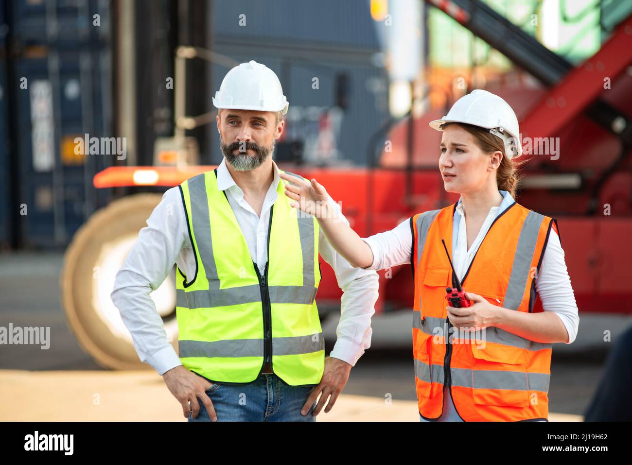 The Problem with businessman talking and checking loading Containers ...