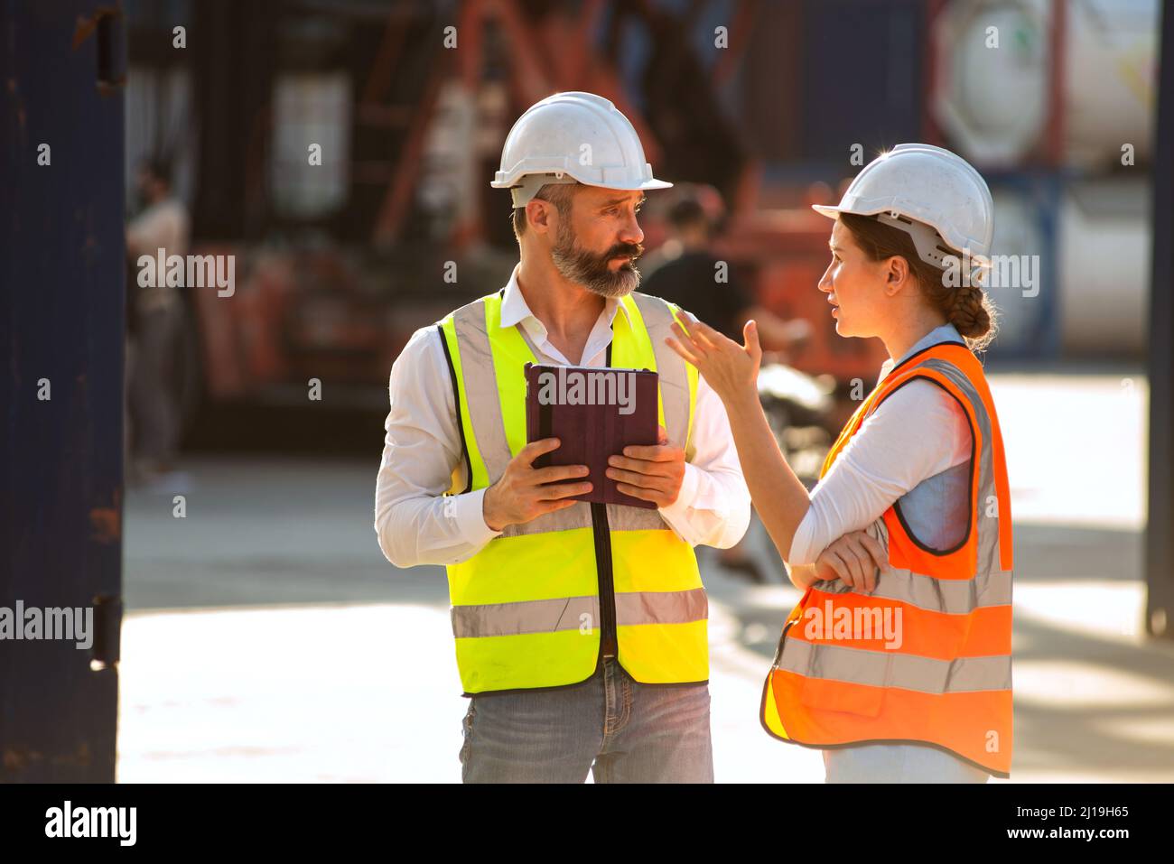 The Problem with businessman talking and checking loading Containers ...