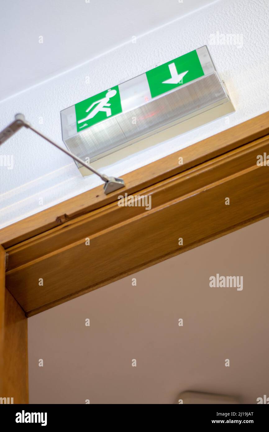 Exit sign, emergency exit sign on top of a door to follow in case of ...