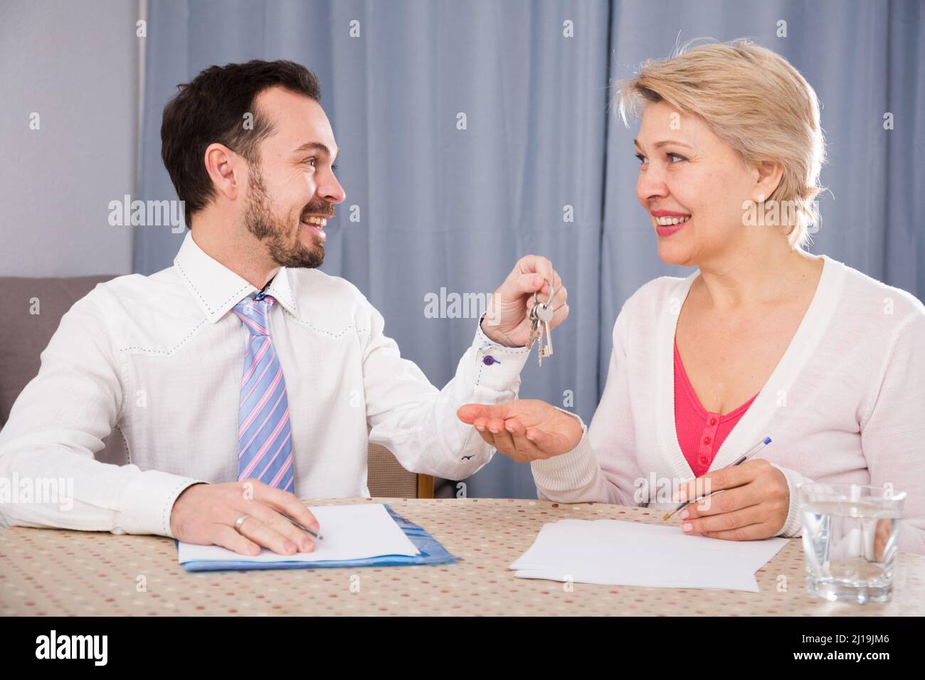 Mature woman and rent agent Stock Photo - Alamy