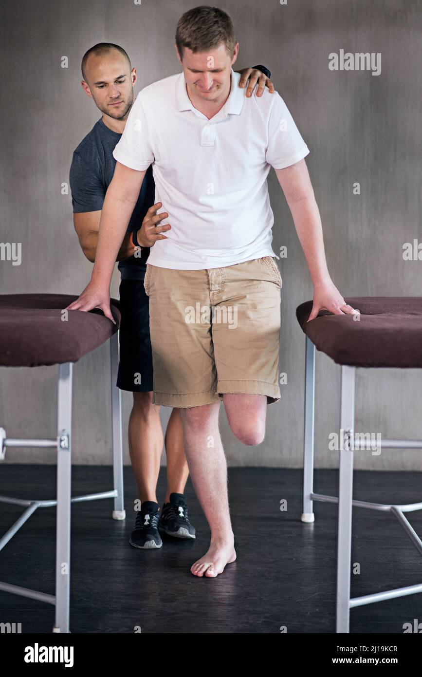 Relearning balance. Shot of a male amputee training with his ...