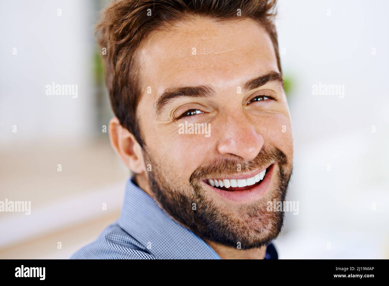 Lifes full of reasons to smile. Portrait of a smiling man in his home ...