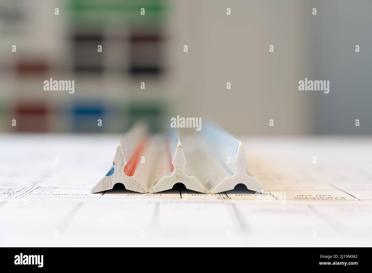 Architectural Scale Ruler with paper blueprints plans for new building ...