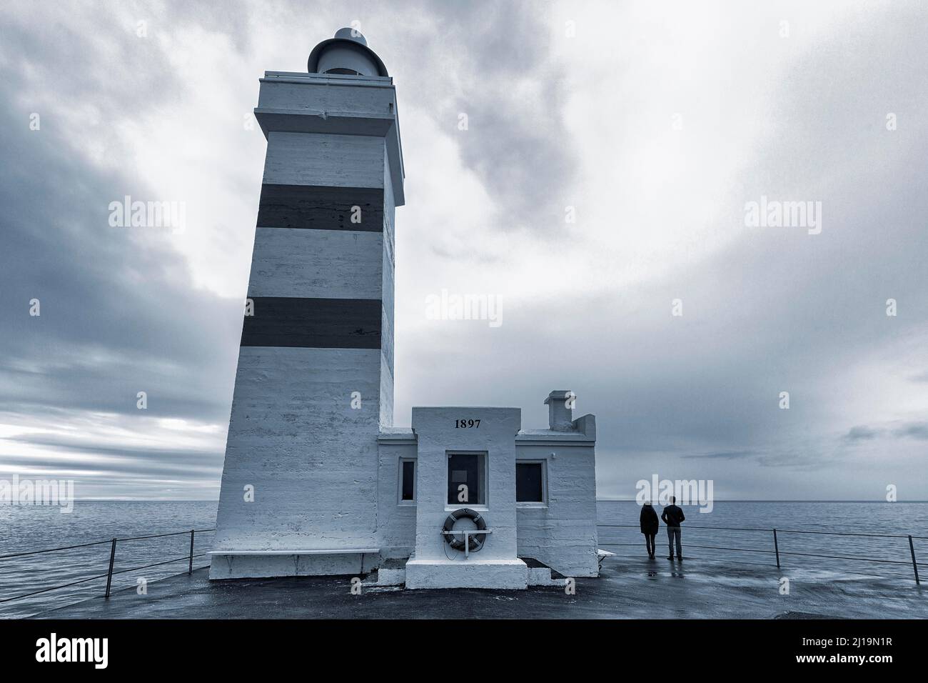 Old lighthouse Garoskagi, Gardskagi, young couple looking at the sea ...